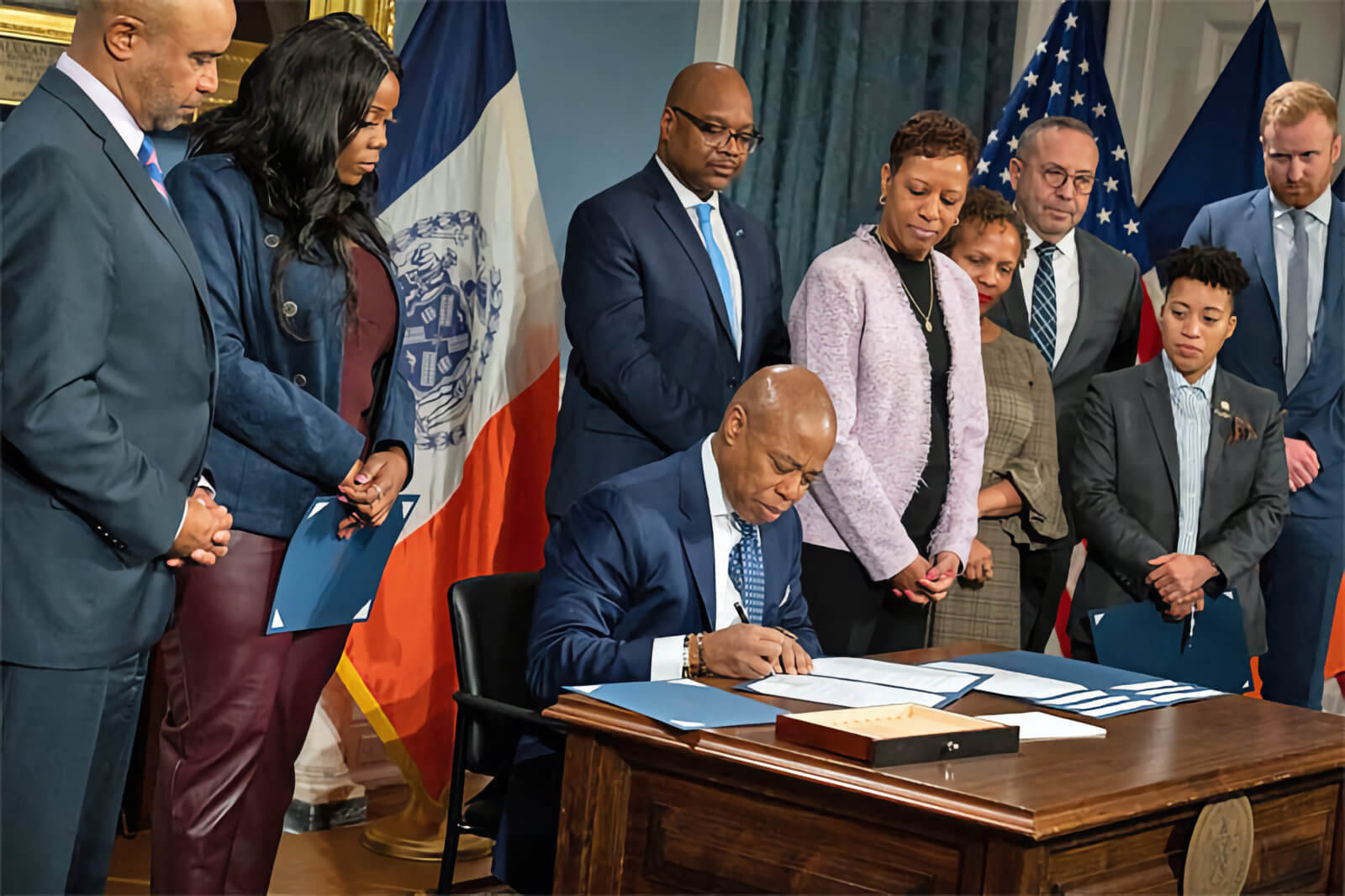 Adams signs legislation to address pay disparities, support New Yorkers ...